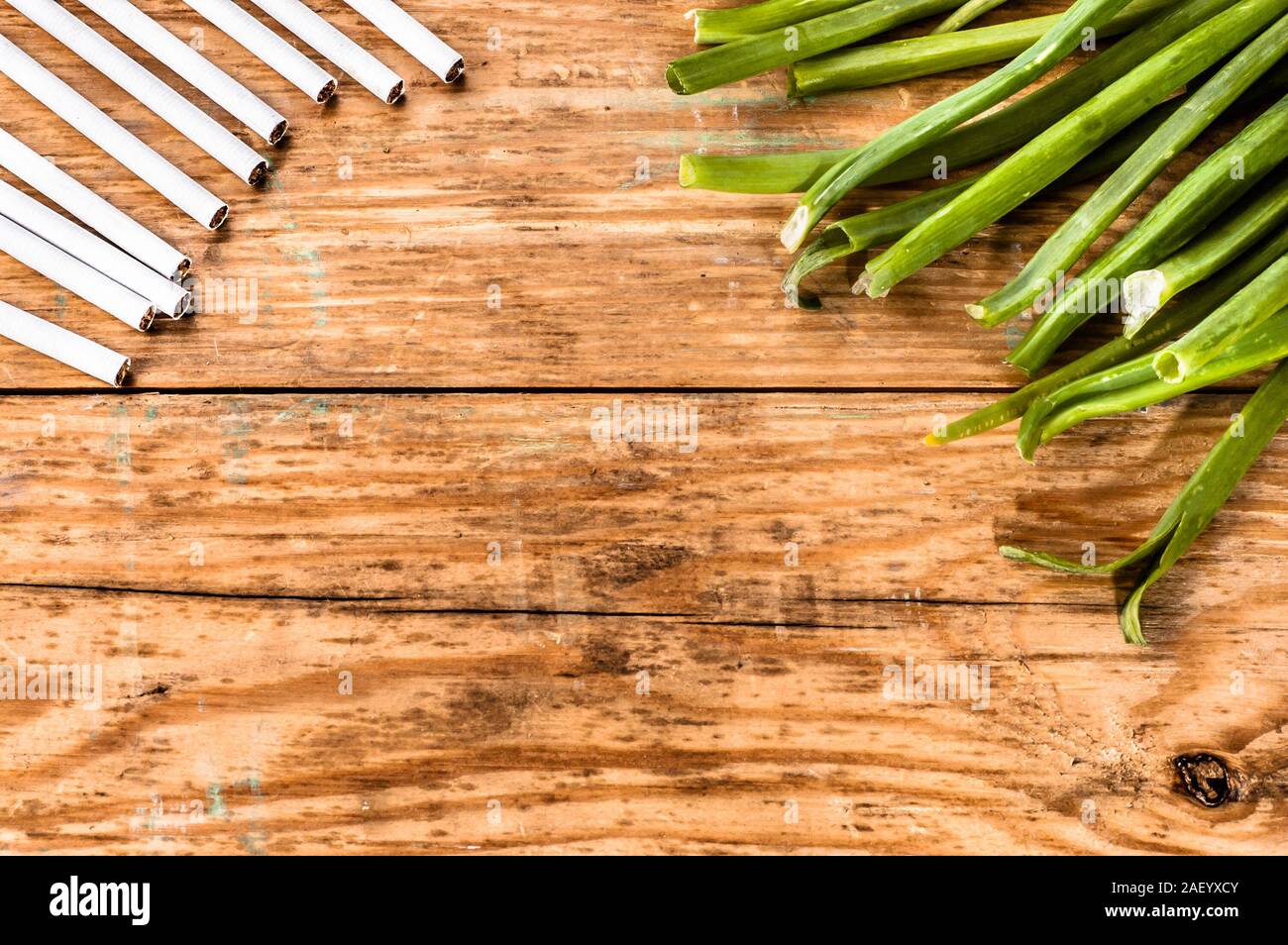 Concepts of quitting smoking. Cigarettes and chive arranged on grunge ...