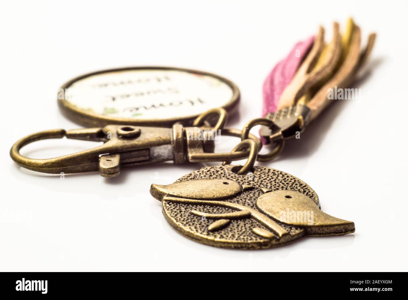 Macro of keychain made with metal and thong isolated on the white ...
