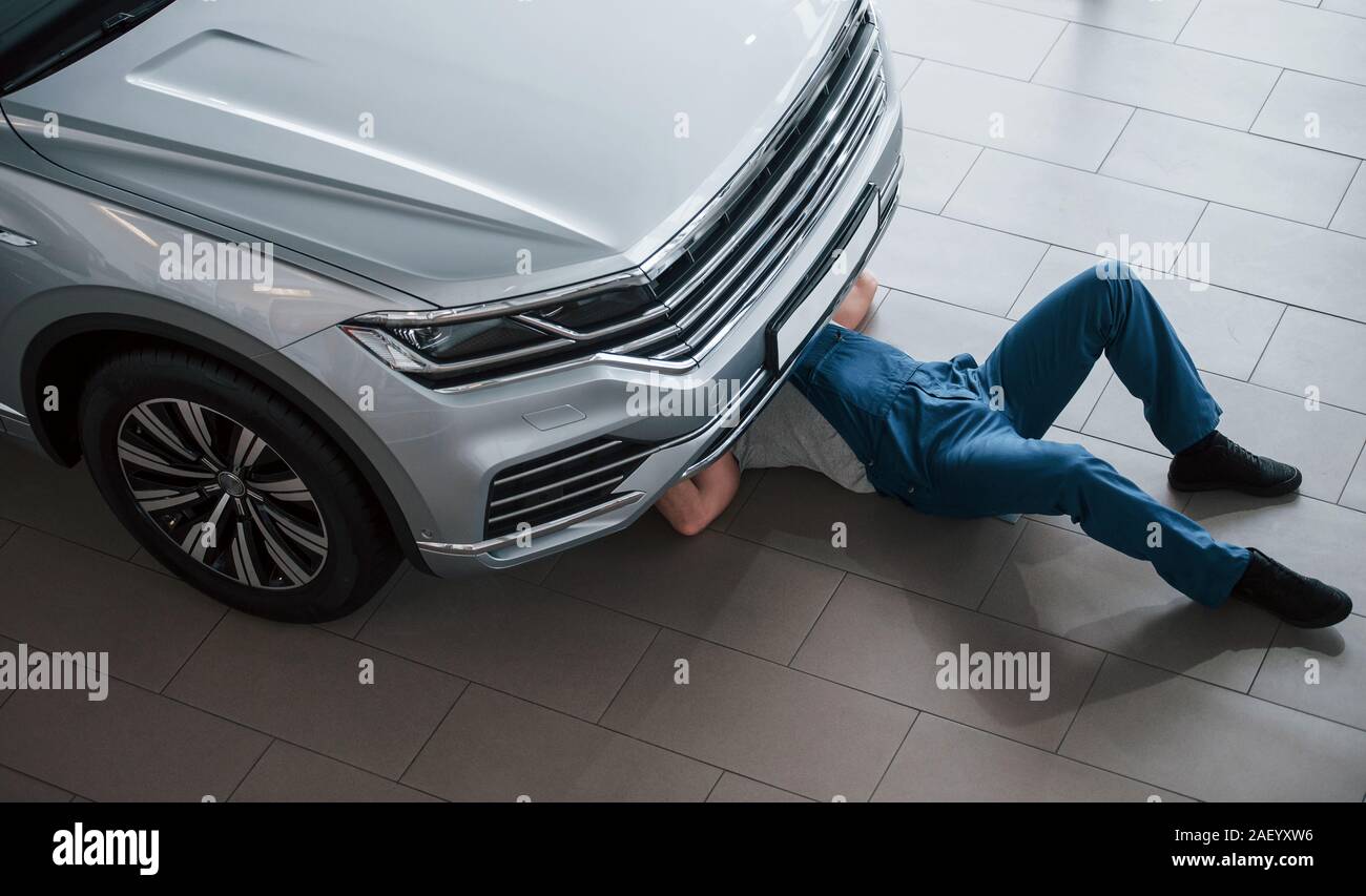Man lying under car hi-res stock photography and images - Alamy