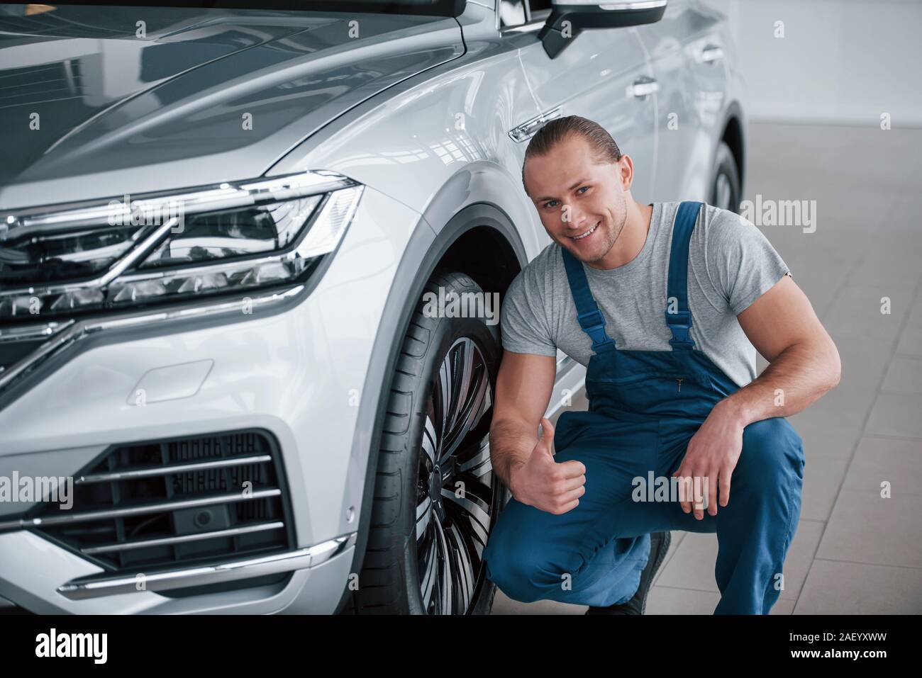 Job well done. After professional repairing. Man looking at perfectly ...