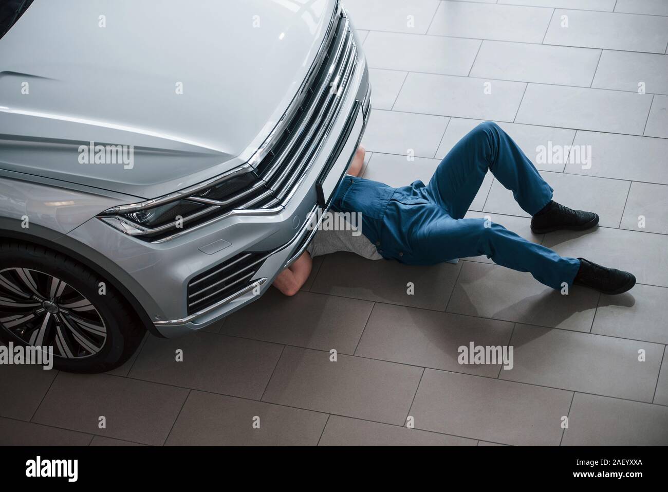 Man Lying Under Car High Resolution Stock Photography and Images - Alamy