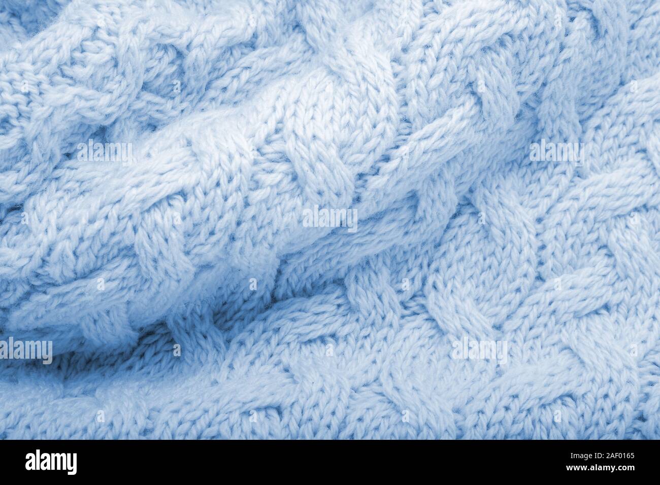 Classic blue knitted fabric wool texture for background. Close up of ...