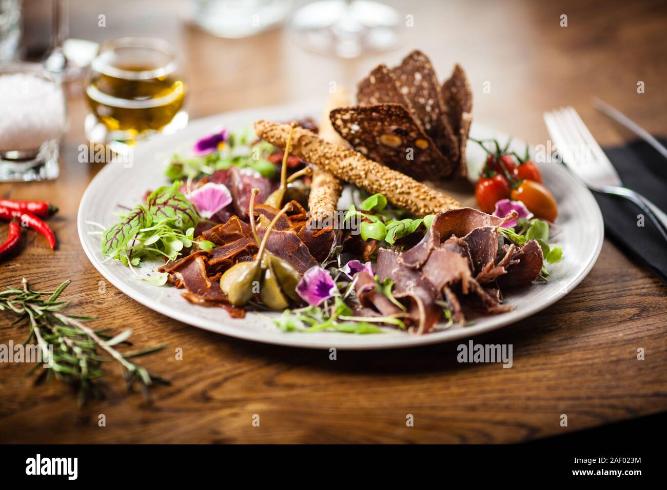 Meat platter for two served on a plate in restaurant Stock Photo - Alamy
