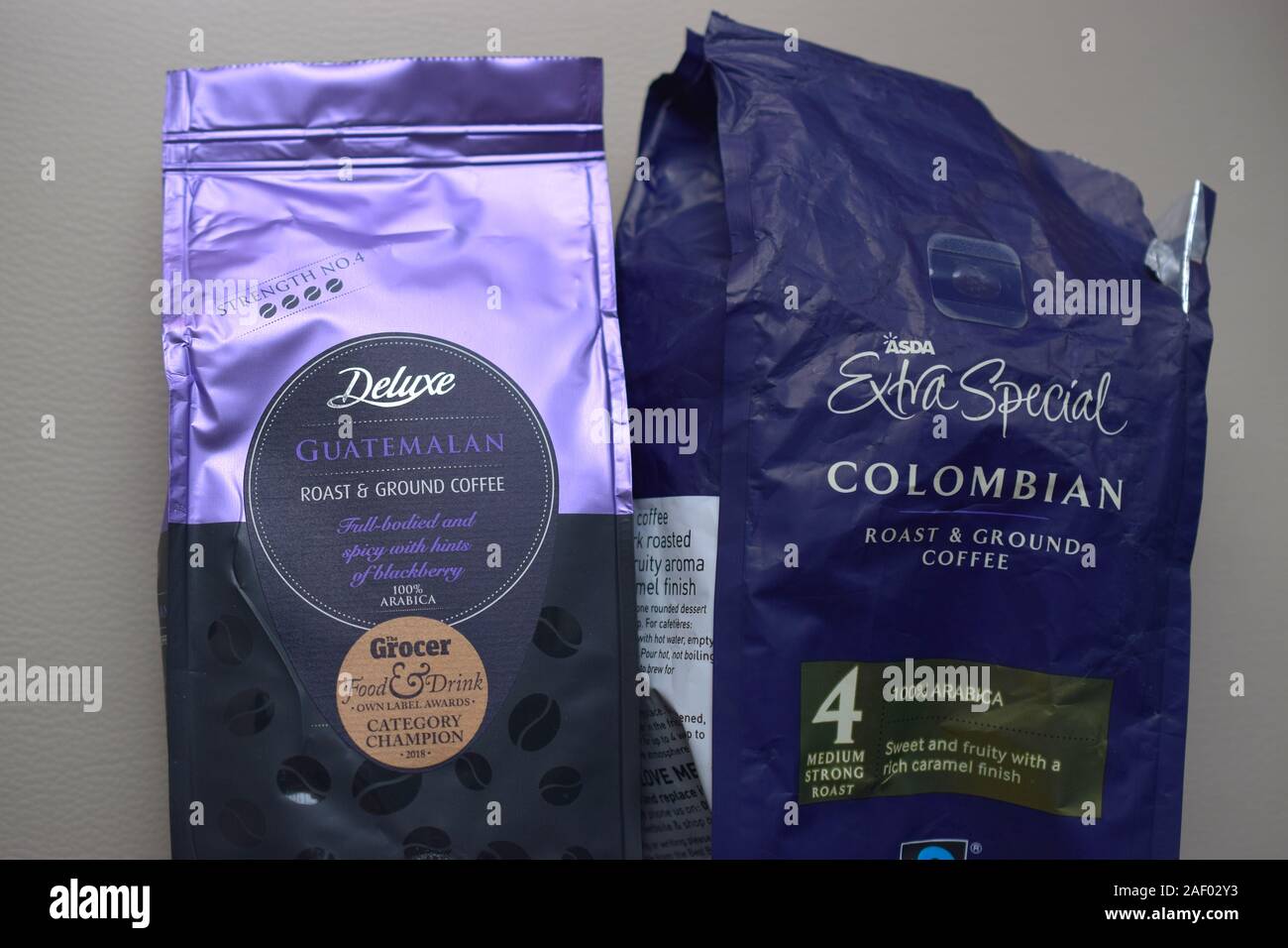 Colombian and Guatemalan ground coffee packages on light background ...