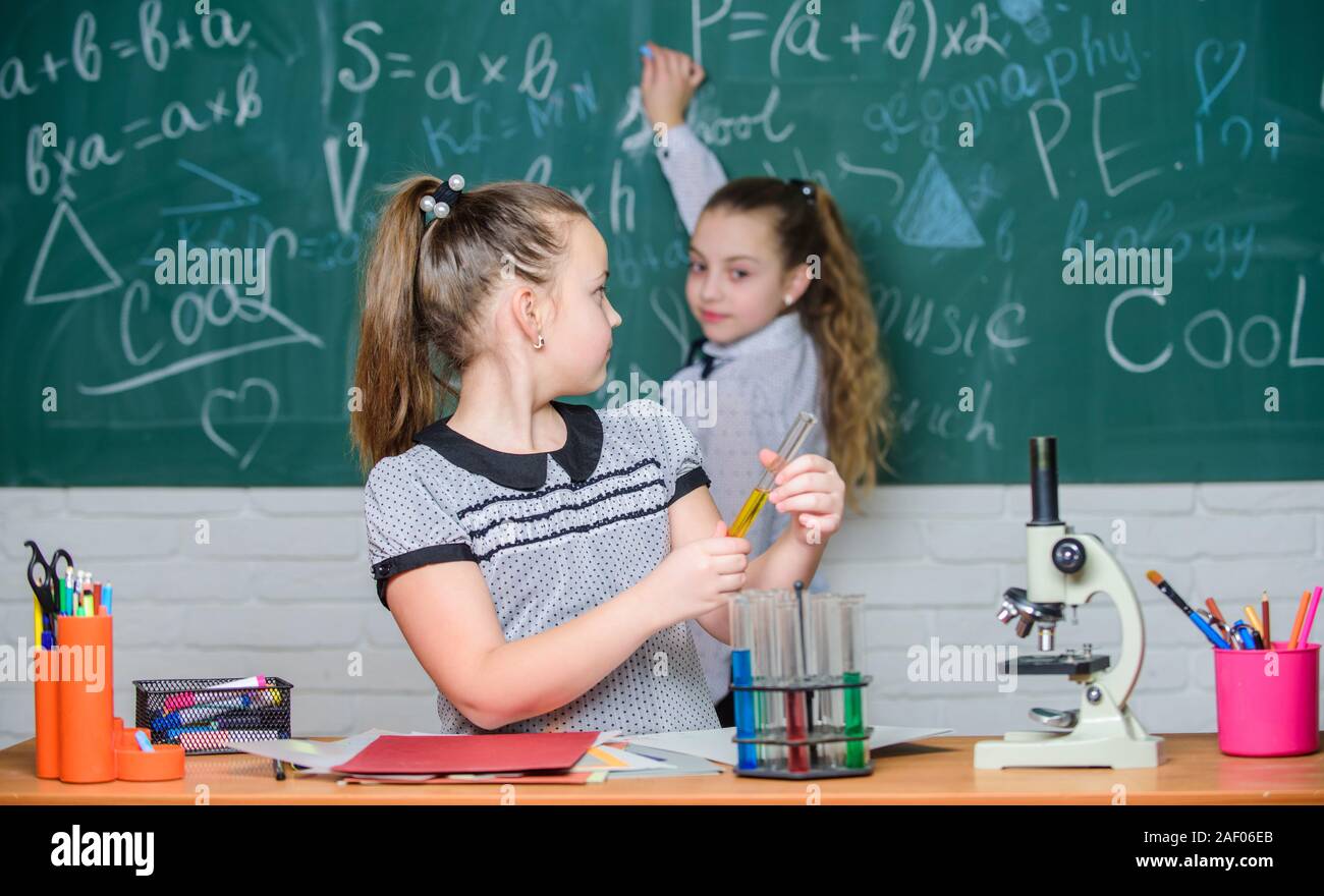 Back to school. School classes. Girls study chemistry in school ...