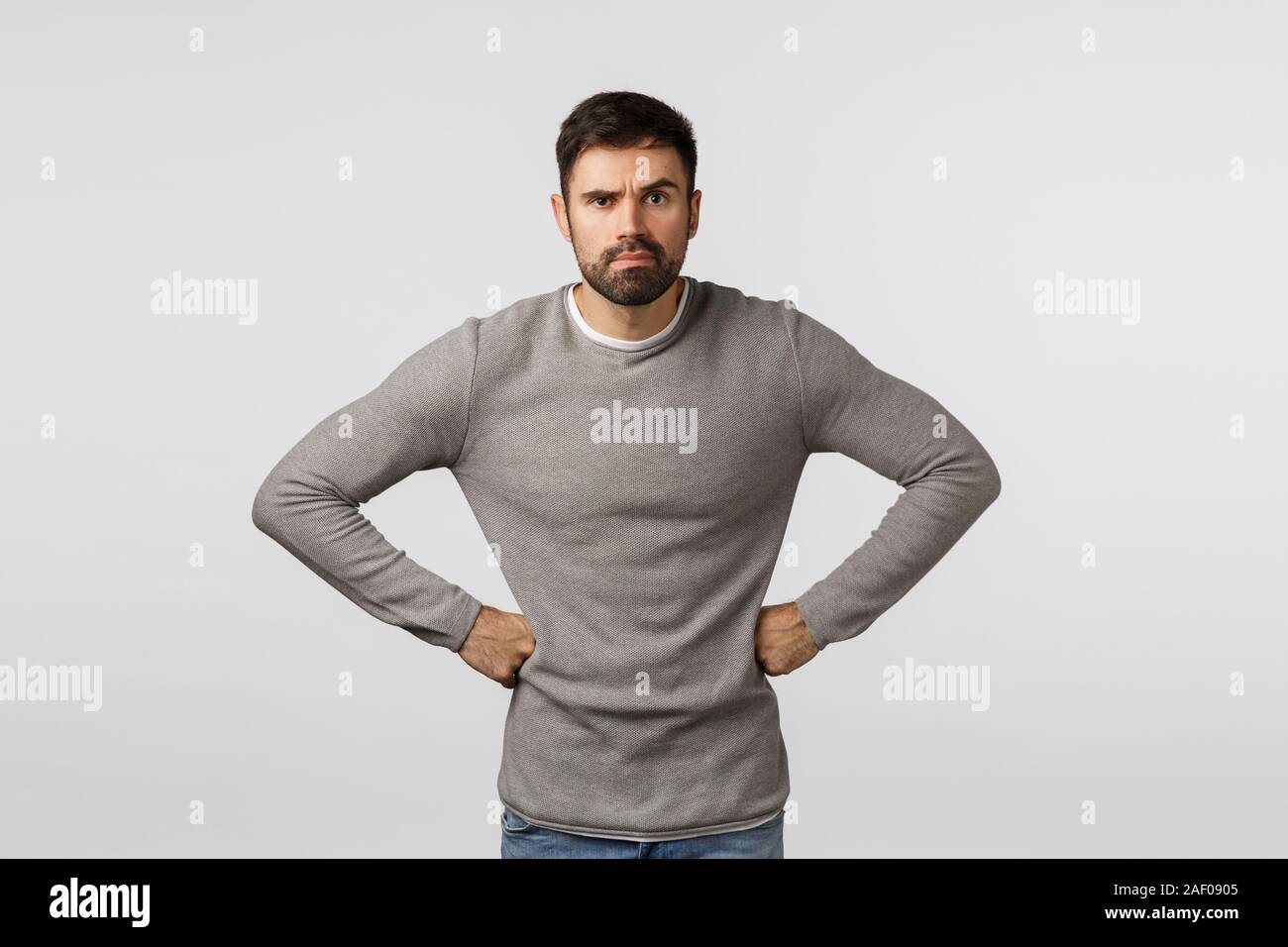 Angry and grumpy, displeased strict or serious male with beard, wear ...