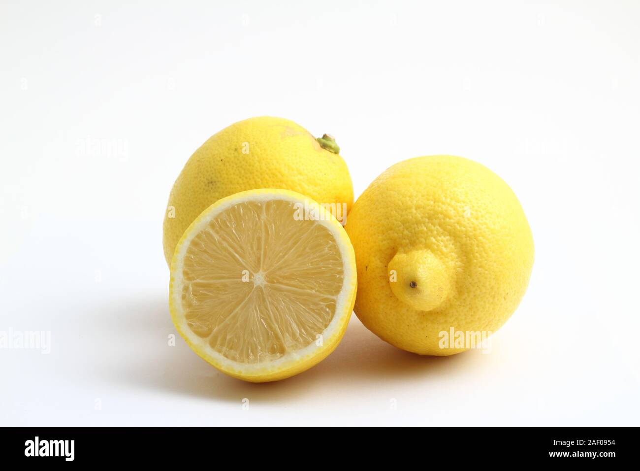 Ripe whole yellow lemon citrus fruit with lemon slice isolated on white ...