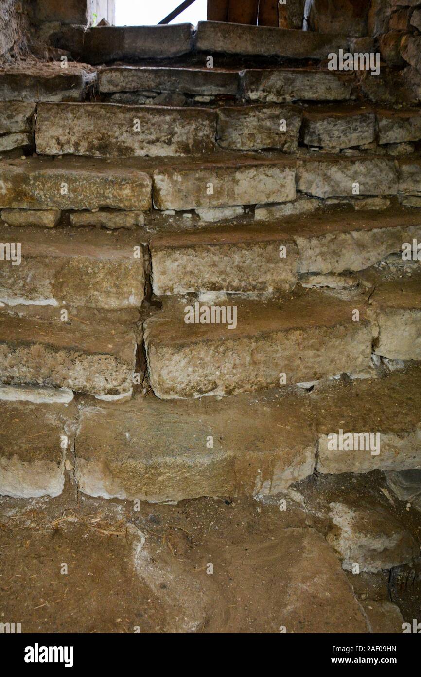 Old stepped stone steps in a castle, in detail , with open door Stock ...