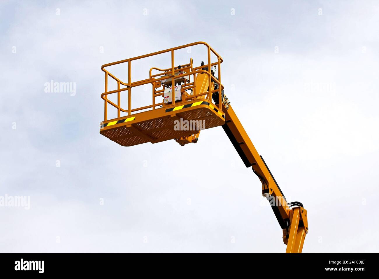 Yellow construction platform bucket for high works Stock Photo - Alamy