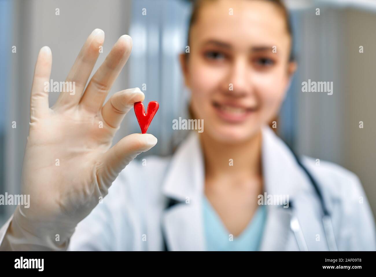 doctor holding simbols of heart in hand with medical care concept ...