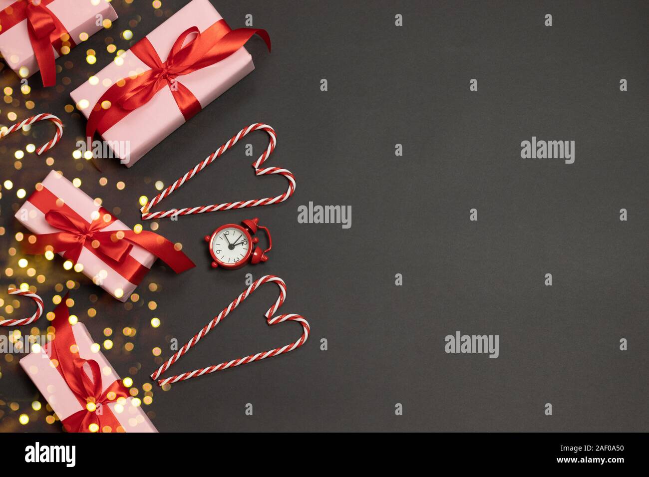 Christmas composition of gift boxes with red ribbons decor, candy cane ...