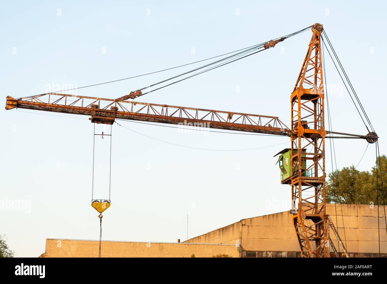 Old rusty construction crane at a construction site Stock Photo - Alamy