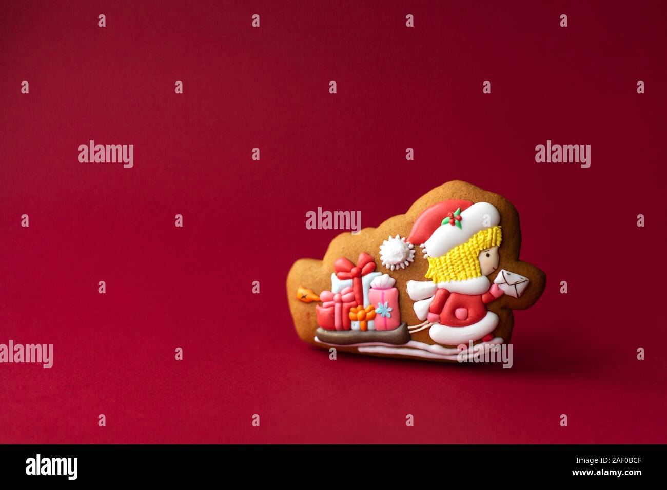 gingerbread cookie of Santa postman on red background. Traditional ...