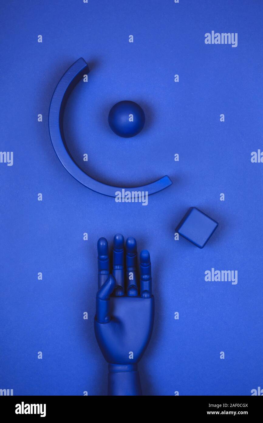 Blue hand with abstract 3d forms. Concept of demonstrating color of the ...