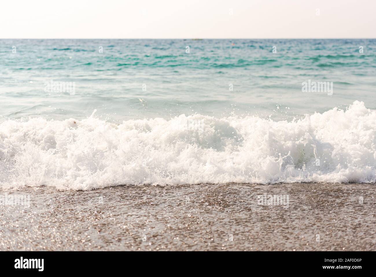 Small waves on beach roll hi-res stock photography and images - Alamy