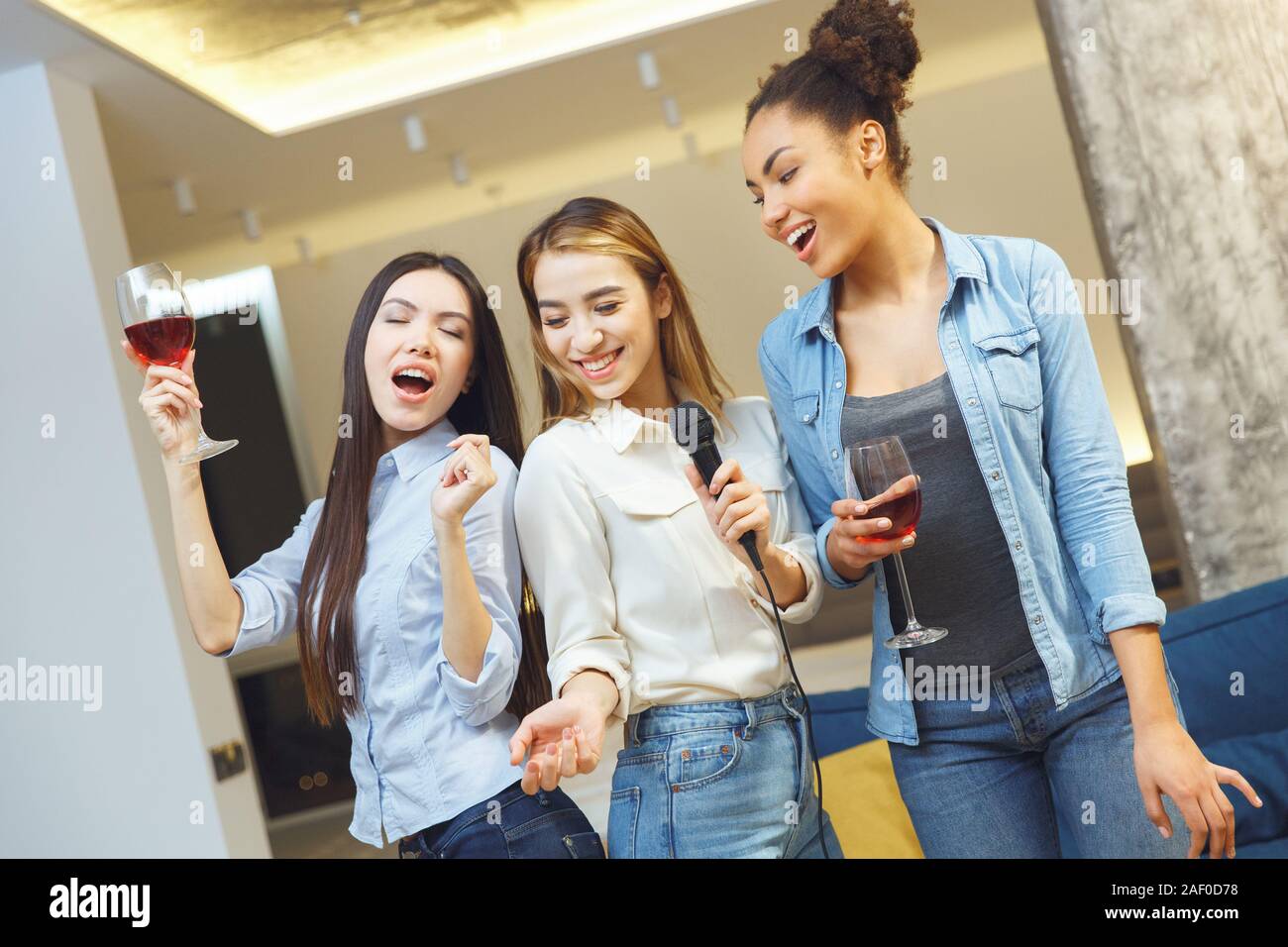 Group of friends having party indoors fun together Stock Photo - Alamy