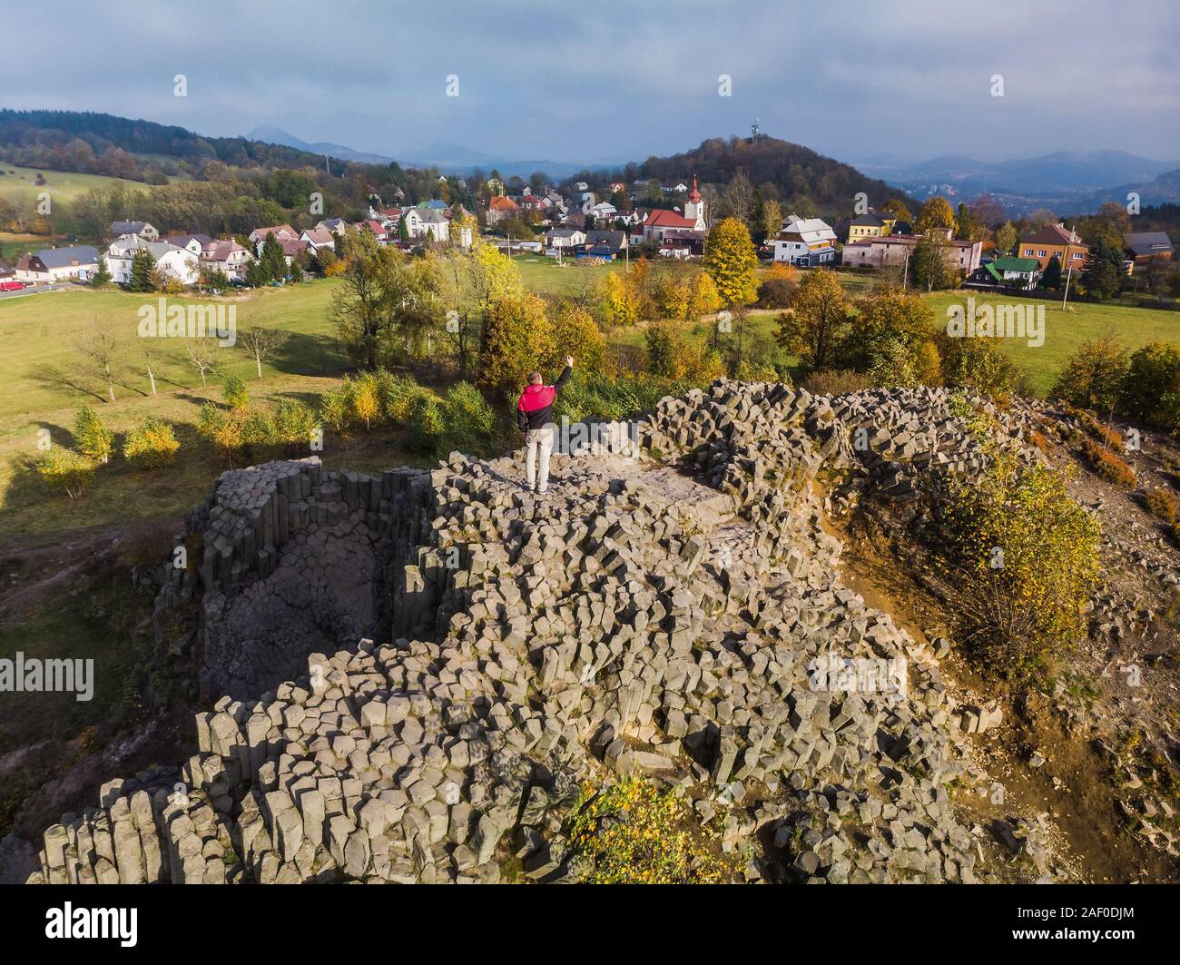 Man makes selfie of the polygonal structures of basalt columns, also ...