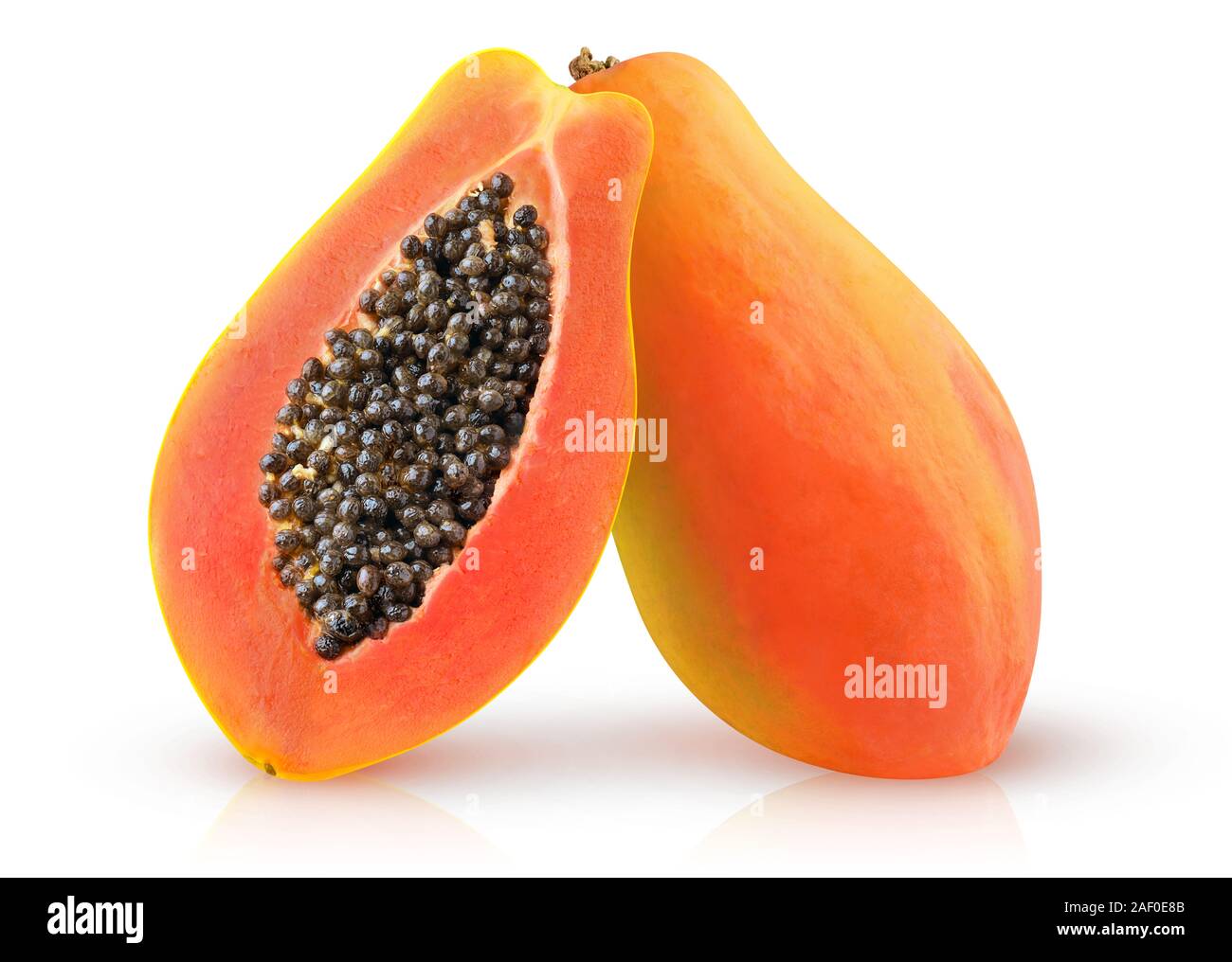 Isolated papaya. Two halves of papaya fruit with seeds isolated on ...