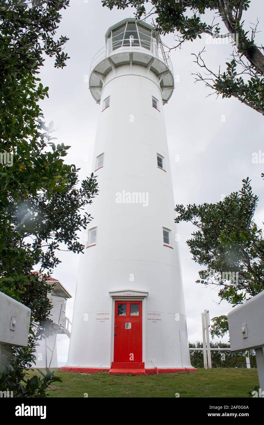 oldest lighthouse NZ still operational, made of cast iron painted white ...