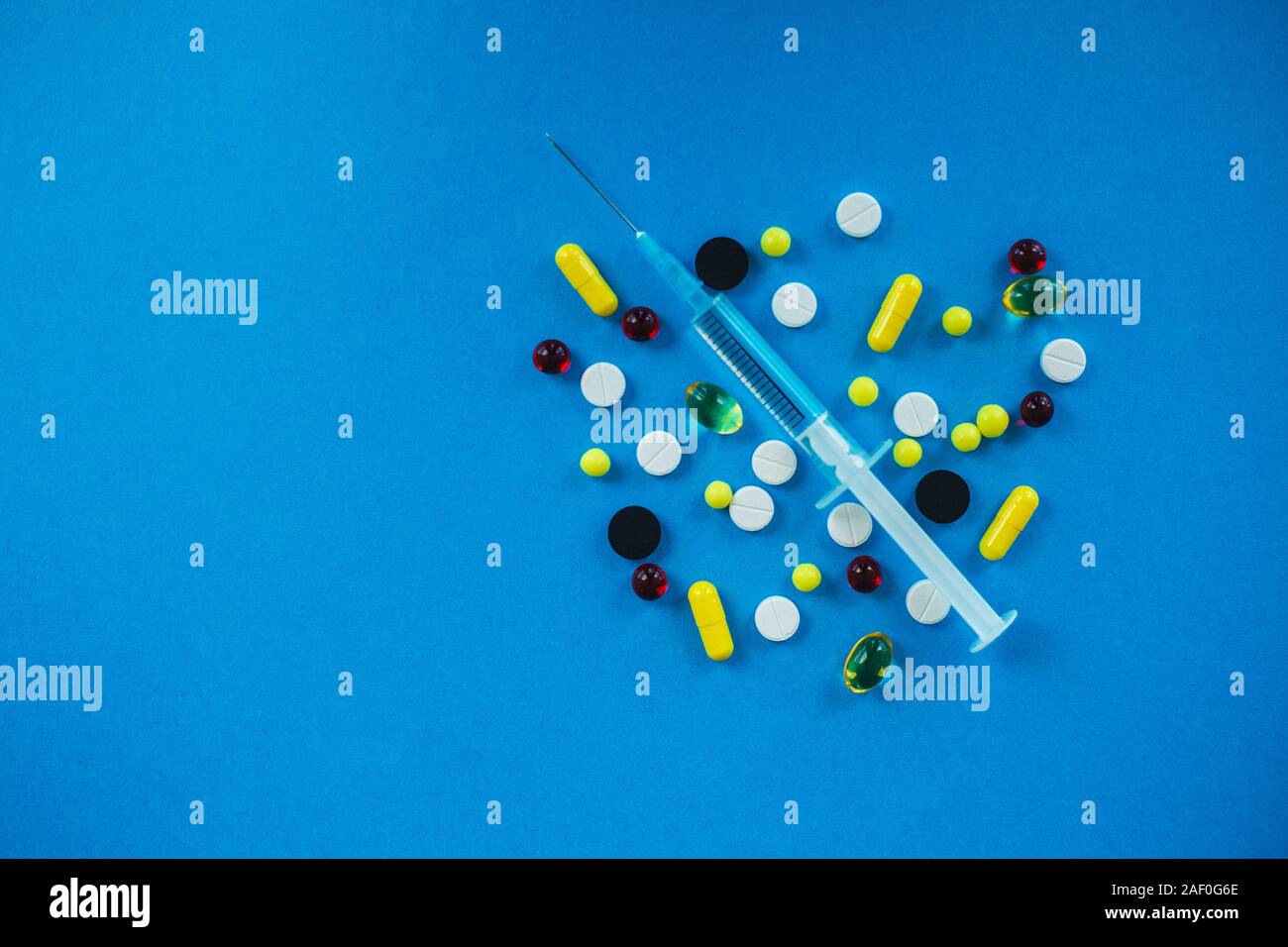 Medical Pills. Colored Pills And Capsule On Blue Background. Pharmacy ...