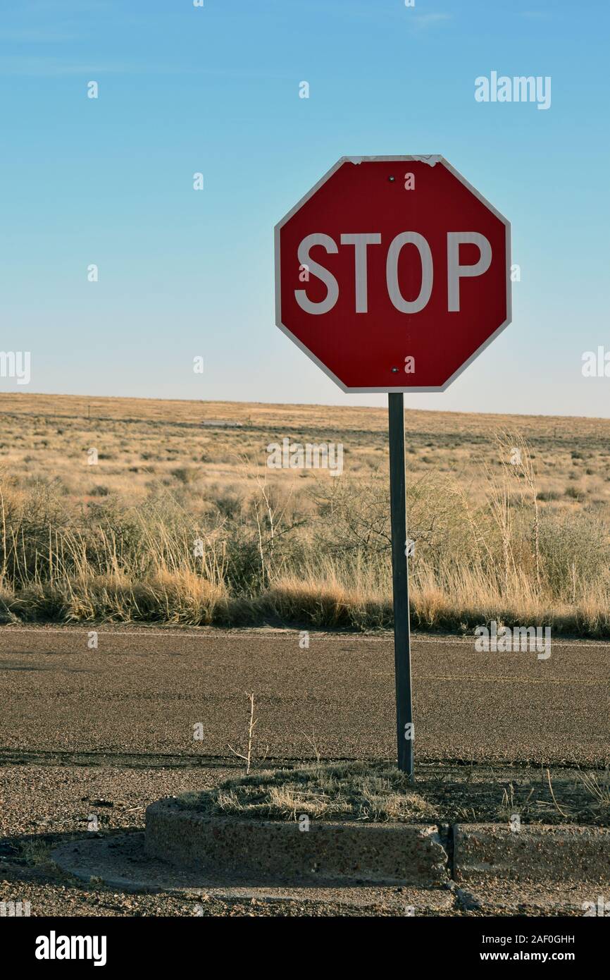 Stop Sign on Lonely Road Stock Photo - Alamy