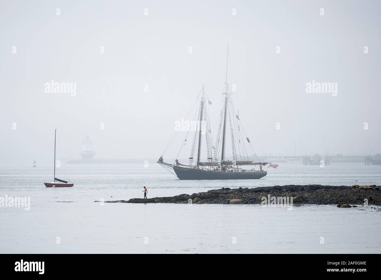 Schooner sailing lighthouse hi-res stock photography and images - Alamy