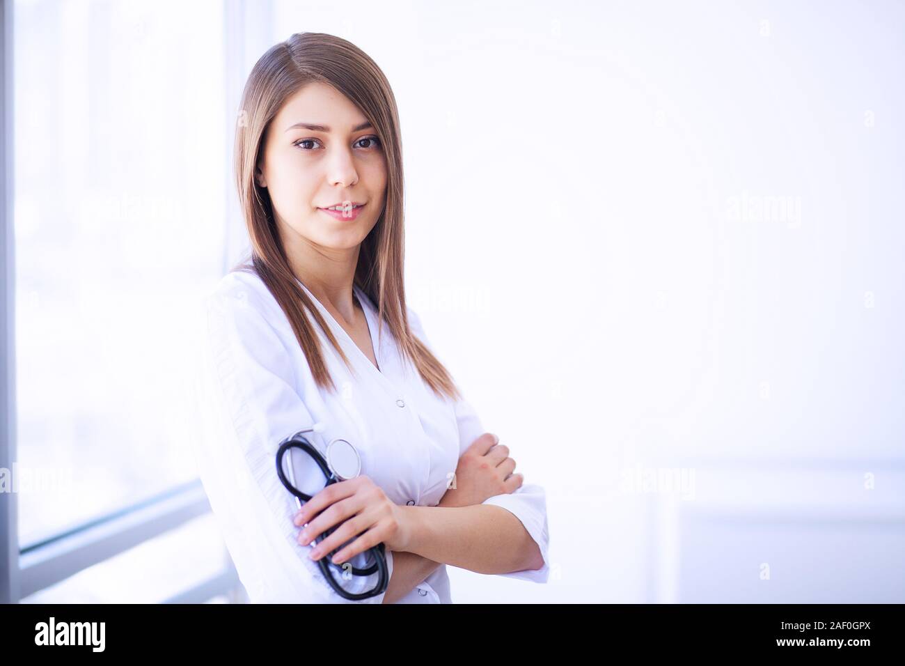 Healthcare Professional. Young female doctor on modern clinic office ...