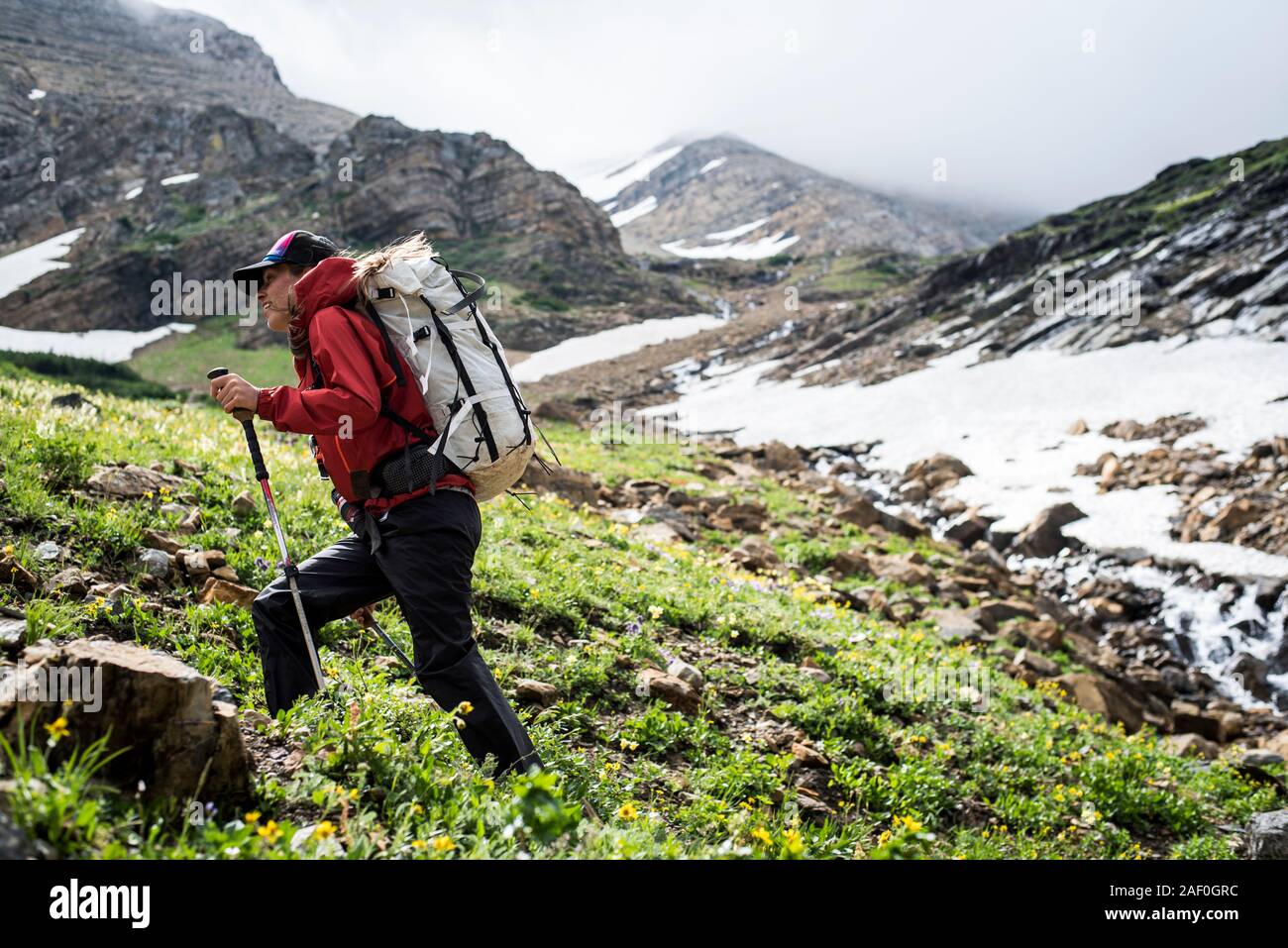 Woman hiking in snowy mountains hi-res stock photography and images - Alamy