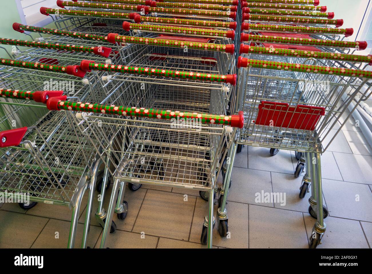 Empty grocery carts in a supermarket closeup. Close up wheel of ...