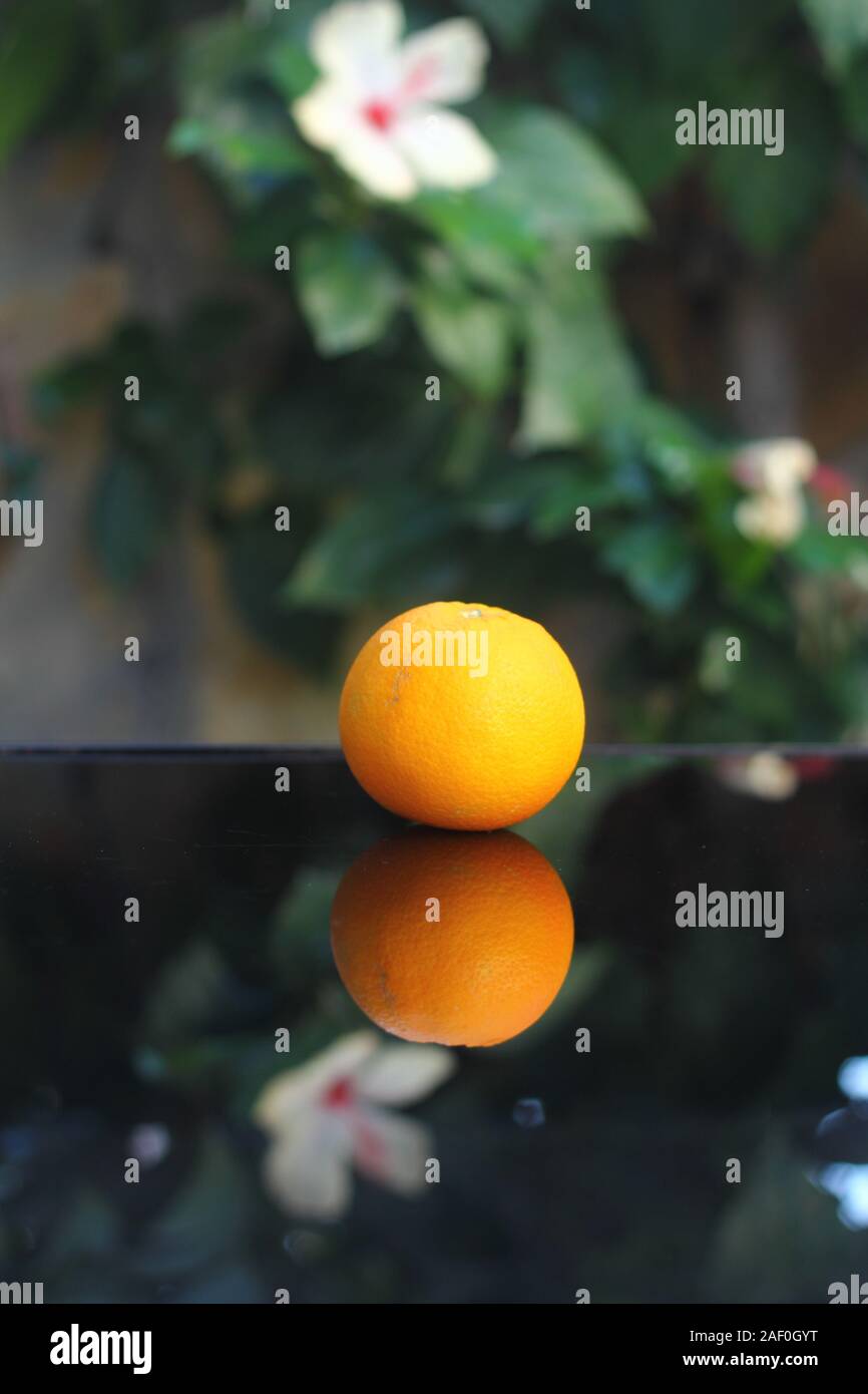 orange on black background. with reflection Stock Photo - Alamy