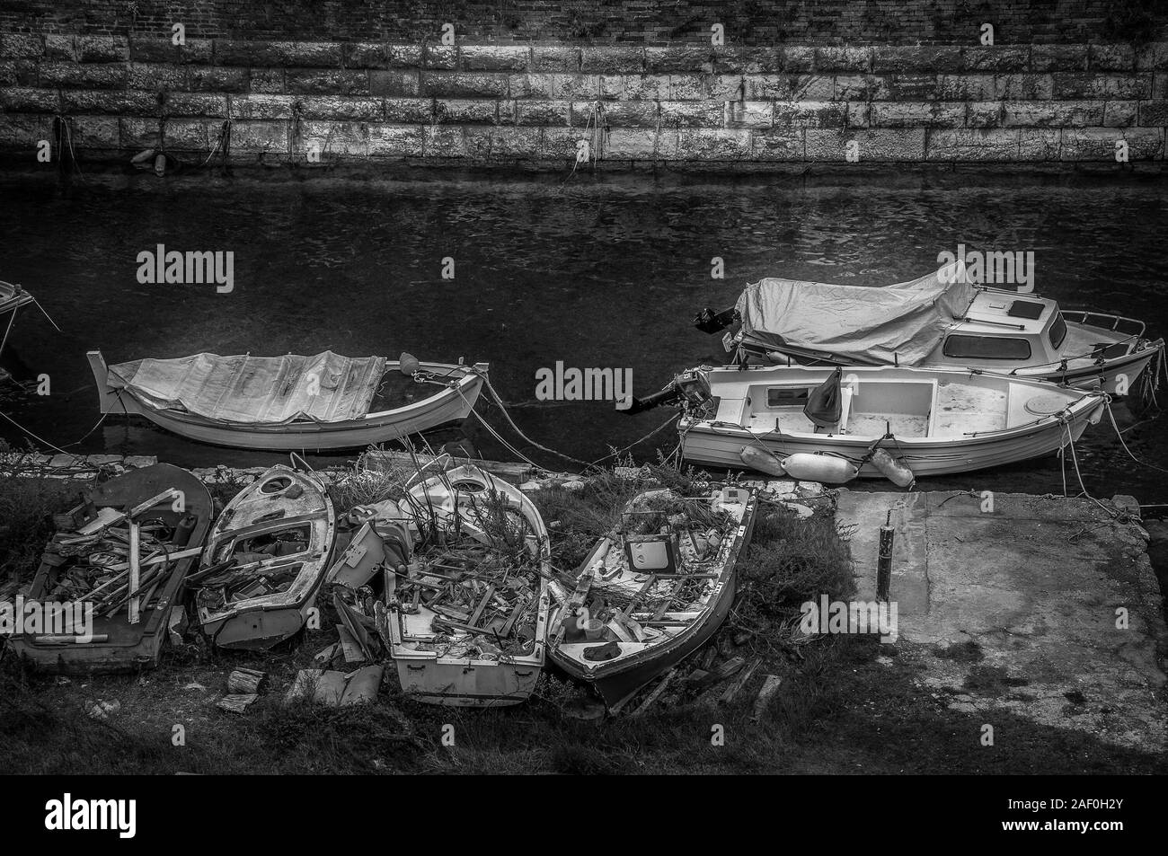 Fishing boats moored old Black and White Stock Photos & Images - Alamy