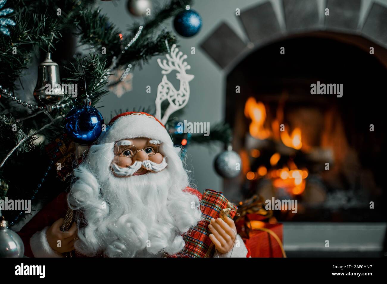 Santa Claus brought gifts for Christmas and having a rest by the ...