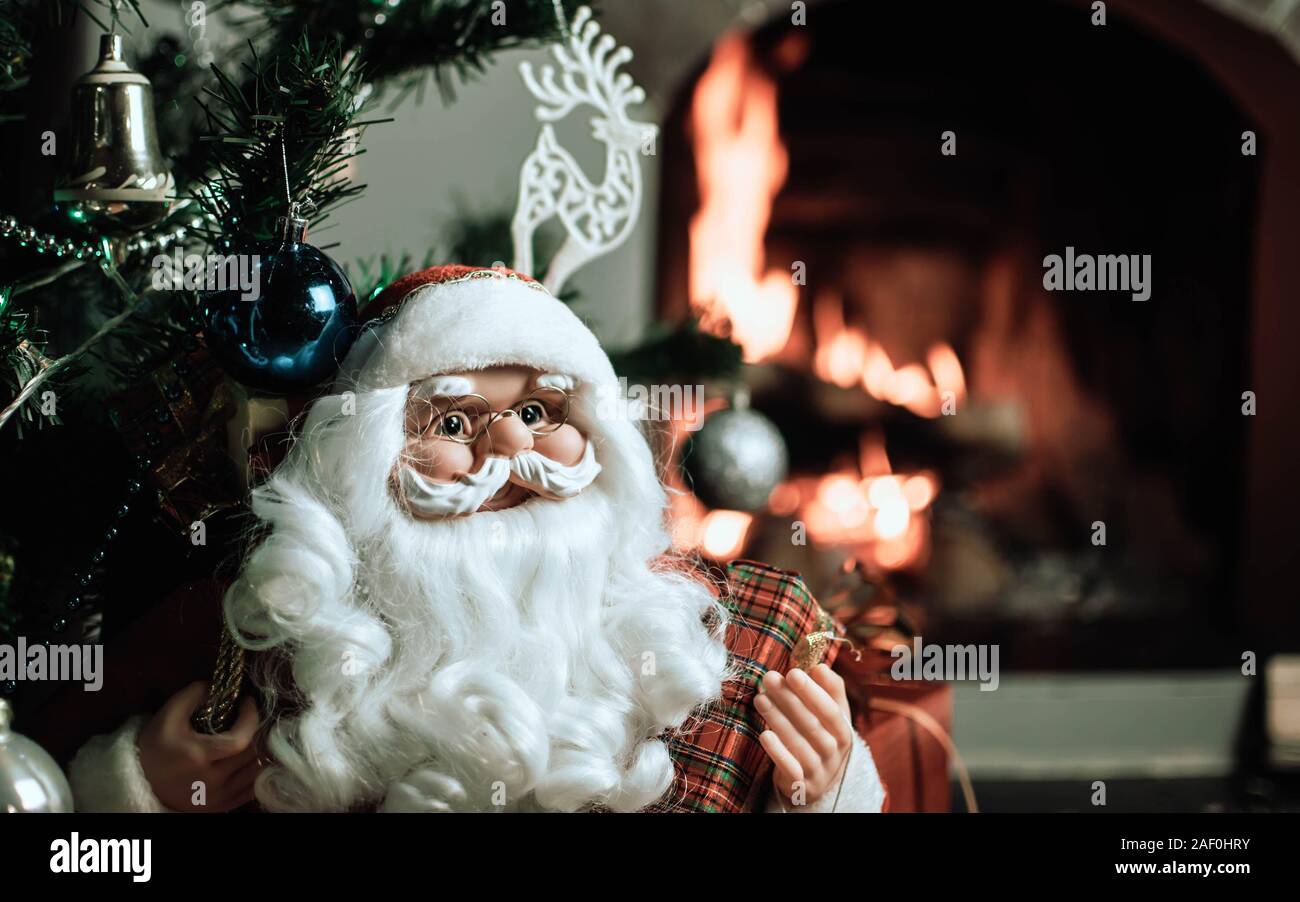 Santa Claus brought gifts for Christmas and having a rest by the ...