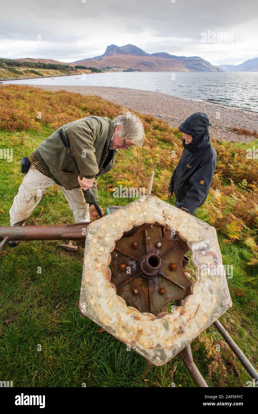 Hugh Piggott doing maintenance on his home made wind turbines in ...