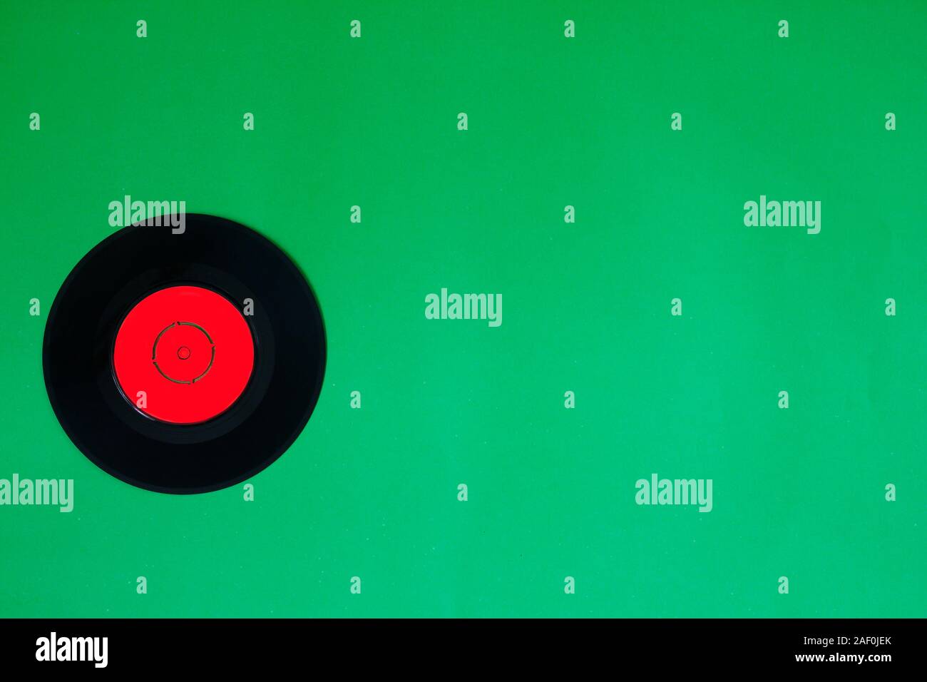 Vinyl record on a green background. Retro style. Top view Stock Photo ...