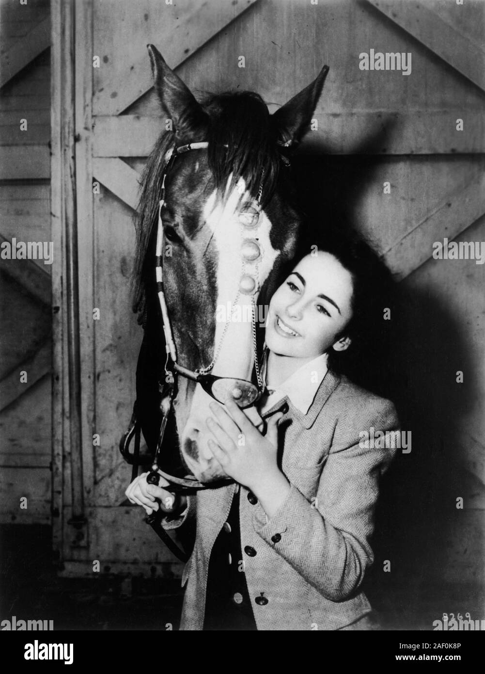 ELIZABETH TAYLOR at age 13 in 1945 with King Charles the horse she rode ...