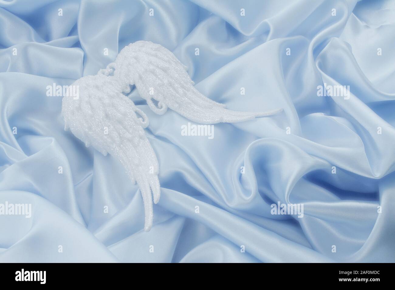 gold glitter angels wings on red background Stock Photo - Alamy