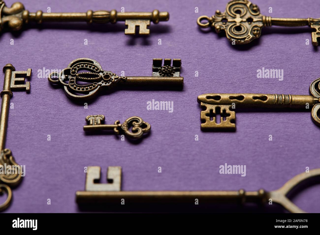 close up view of vintage keys on violet background Stock Photo - Alamy