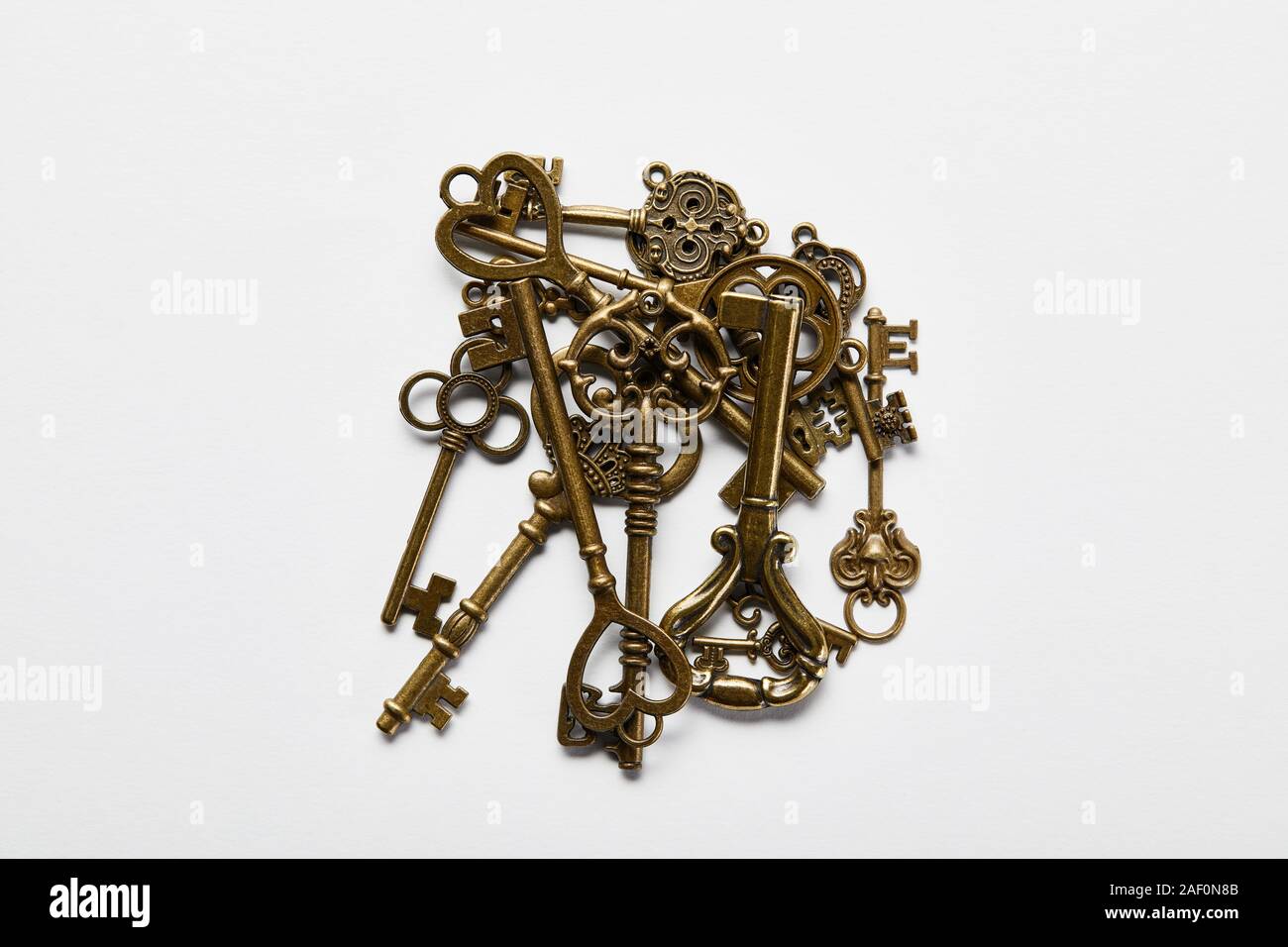 top view of vintage keys in stack on white background Stock Photo - Alamy