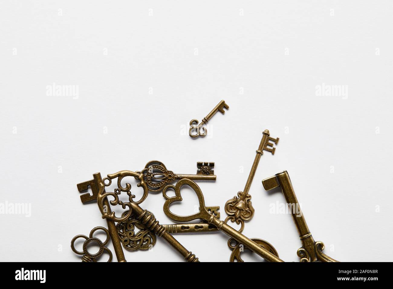 top view of vintage keys in stack on white background Stock Photo - Alamy