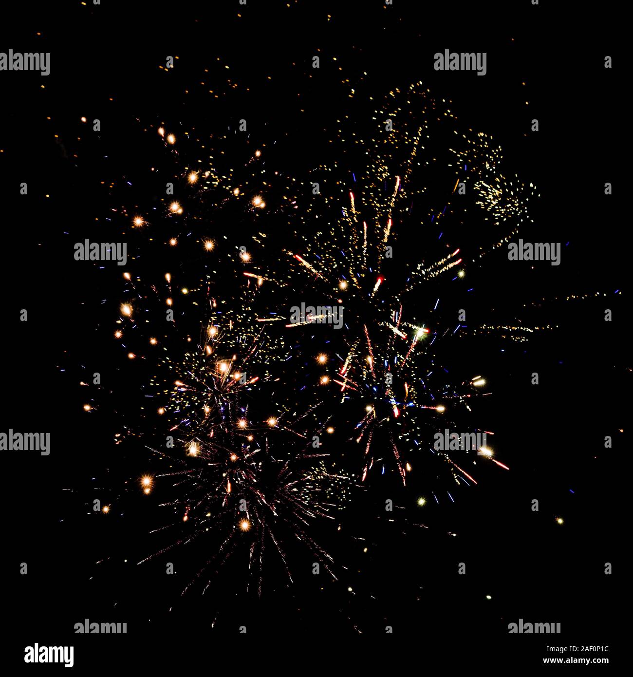 golden traditional fireworks in night sky, isolated on black Stock ...