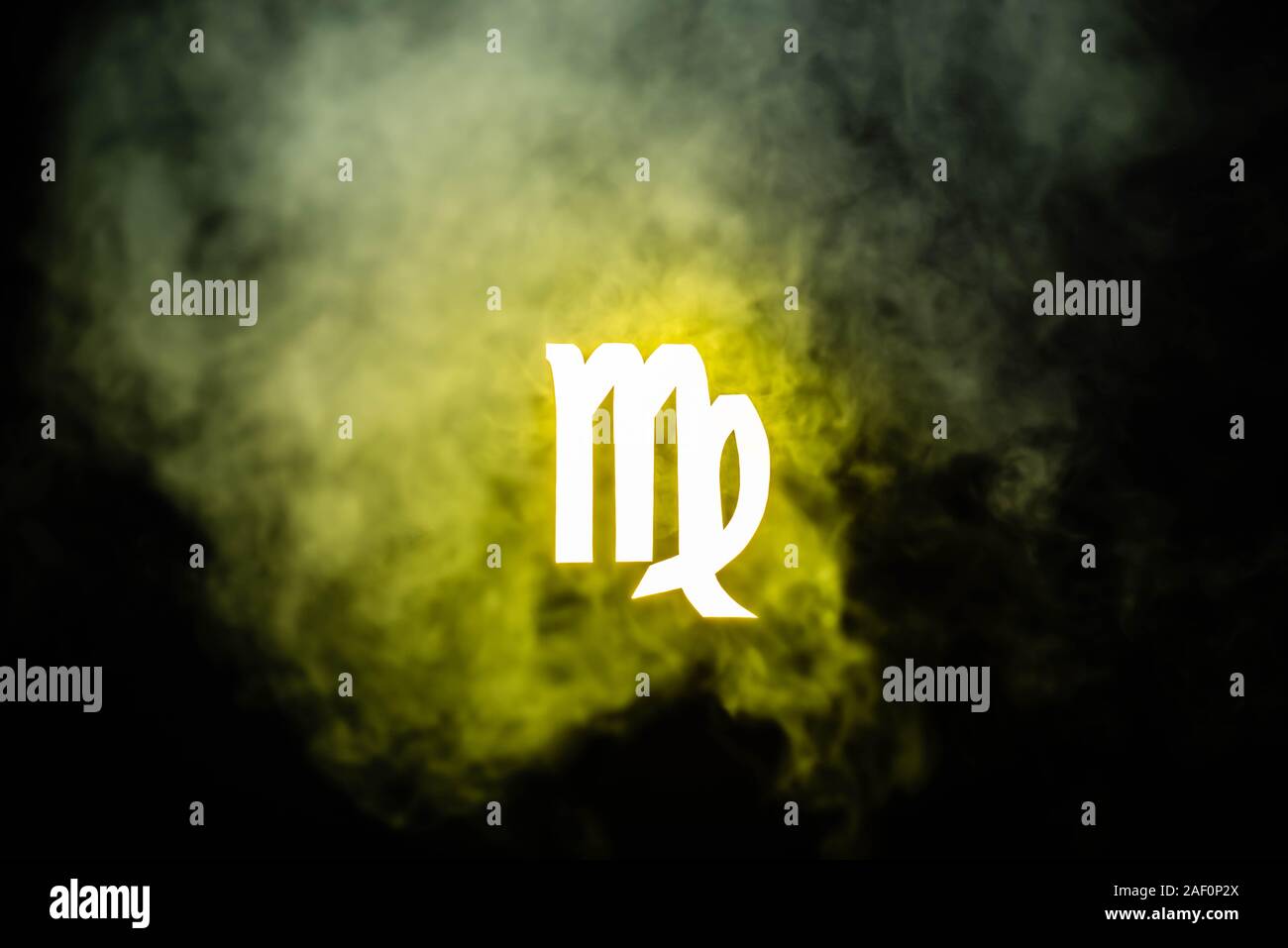 yellow illuminated Virgo zodiac sign with smoke on background Stock ...