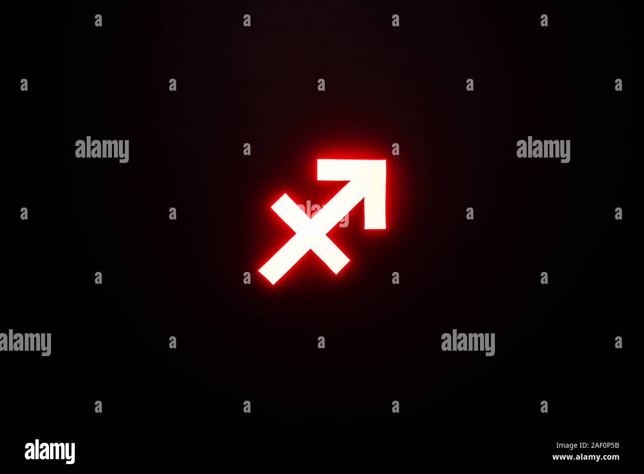 red illuminated Sagittarius zodiac sign isolated on black Stock Photo ...