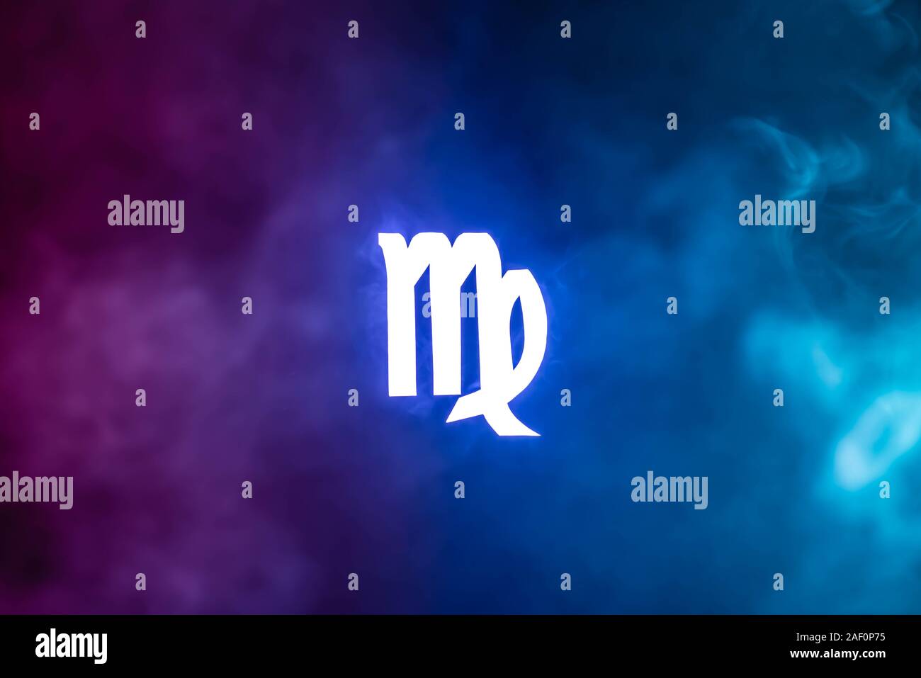 blue illuminated Virgo zodiac sign with colorful smoke on background ...