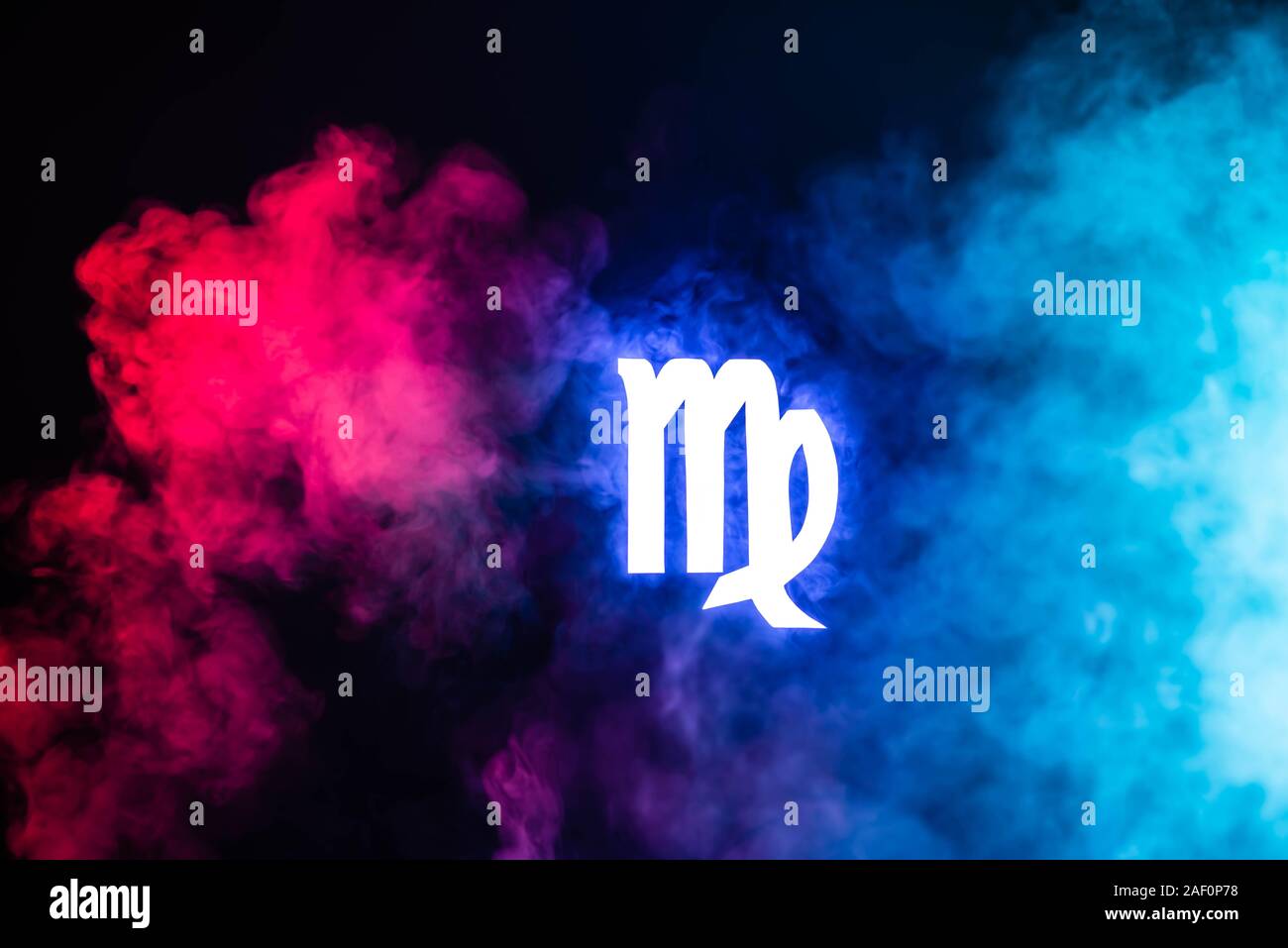 blue illuminated Virgo zodiac sign with colorful smoke on background ...