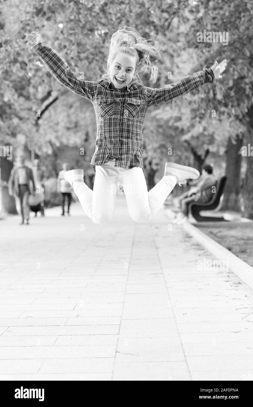 Tireless and energetic activity. Small child jumping in casual fit for ...