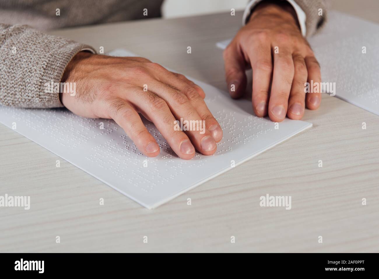 Hands reading braille hi-res stock photography and images - Alamy
