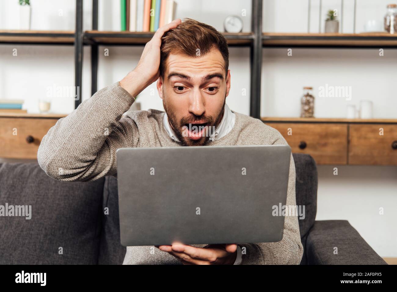 Shocked man looking down hi-res stock photography and images - Alamy