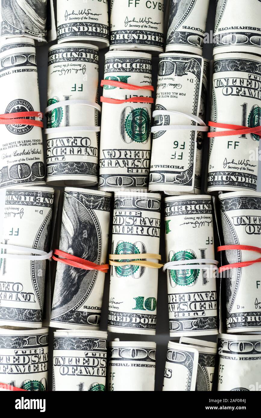 top view of cash rolls with colorful rubber bands Stock Photo - Alamy