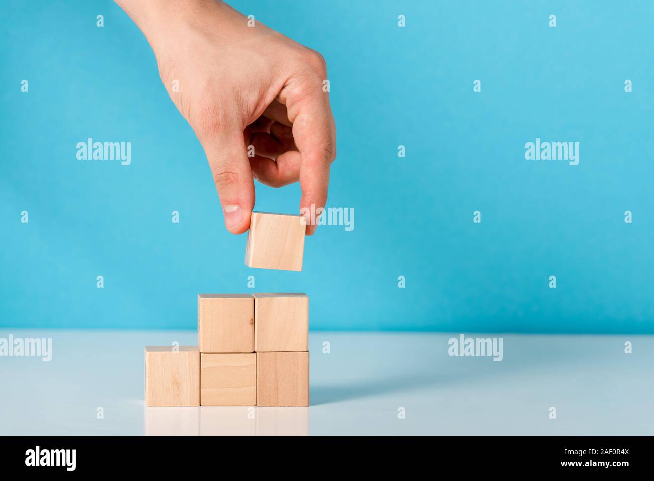 Man hold blue cube hi-res stock photography and images - Alamy